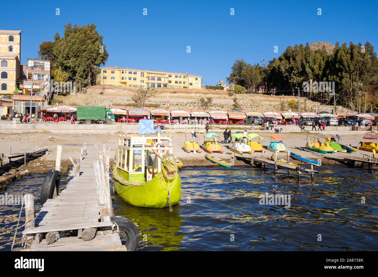 Replica for tourists of a traditional totora boat in a pier in ...