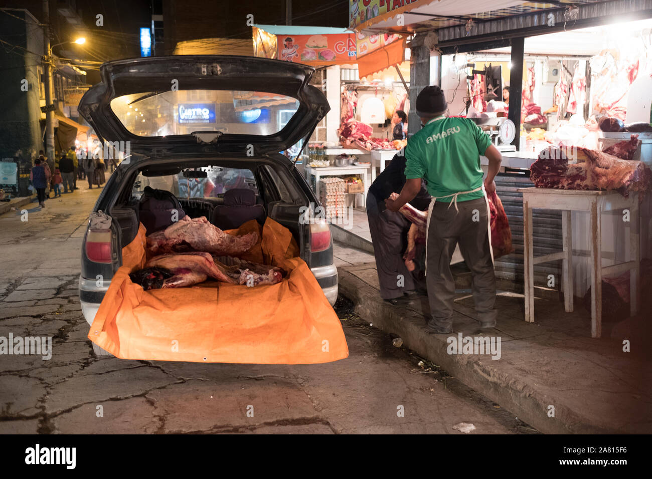 Local people delivering fresh llama meat at Food Market of Copacabana ...