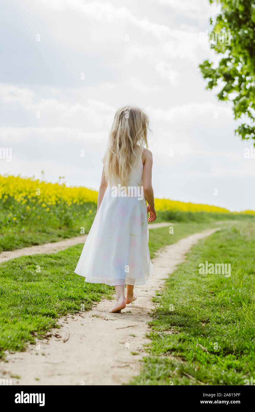 child in rural path alone leaving Stock Photo - Alamy