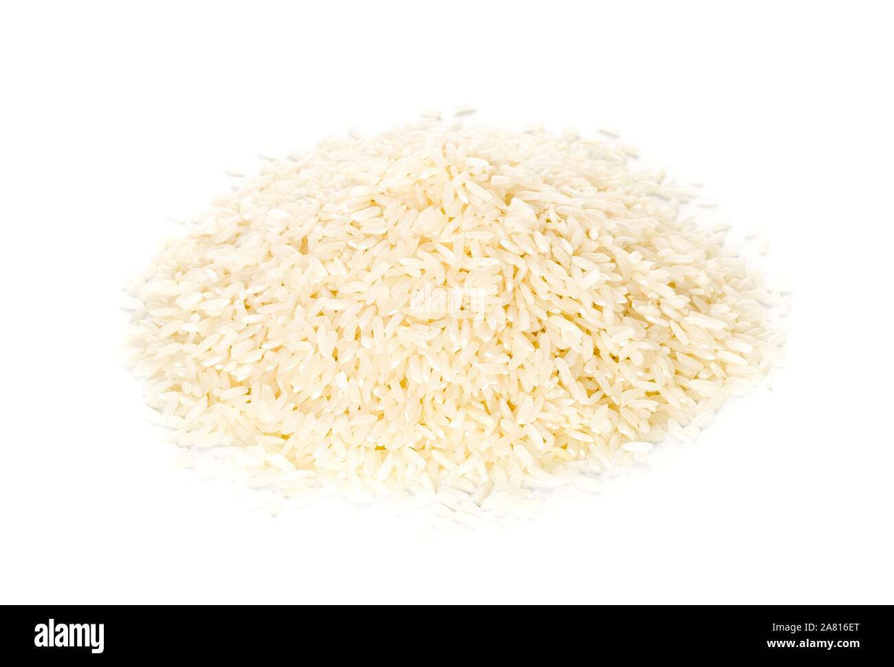 Heap of white uncooked, raw long grain rice on white background Stock ...