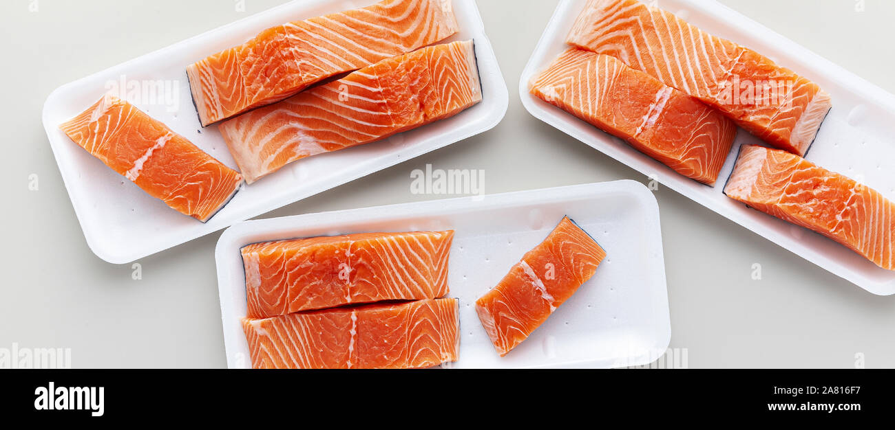 banner of fresh salmon, cut into pieces and ready for cooking. fish ...
