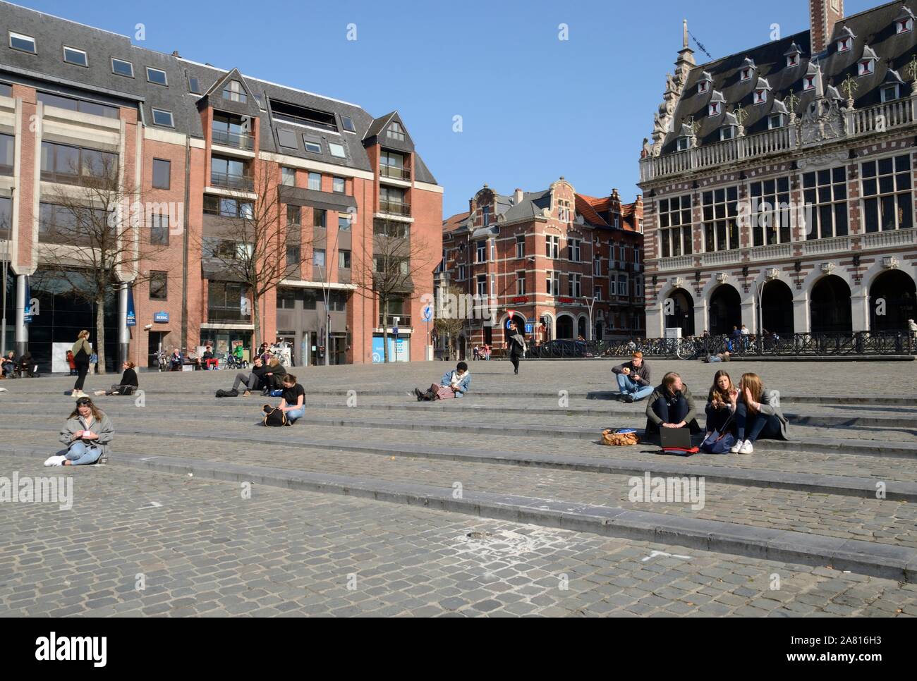 Leuven, Belgium - April 1, 2019: Students seated on cobbled steps at ...