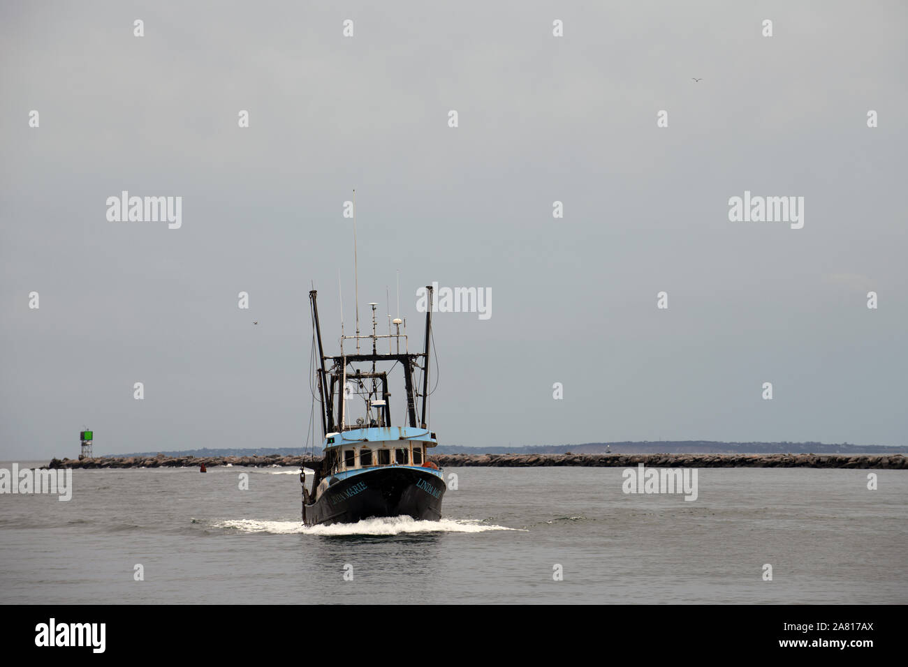 Fishing boat coming into port in Galilee Rhode Island Stock Photo - Alamy