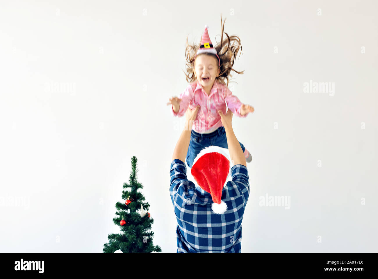 Christmas, holidays and fatherhood concept - Funny dad wearing santa ...