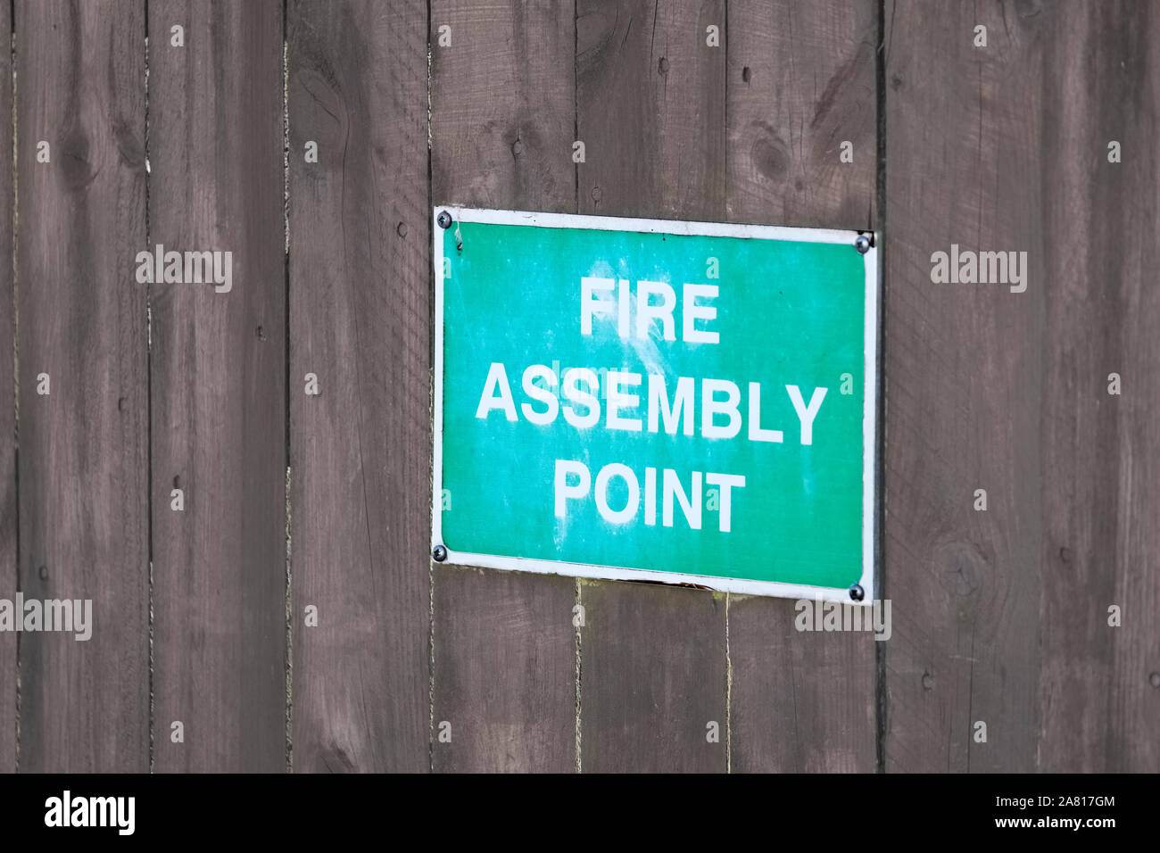Fire assembly point sign at office work place Stock Photo - Alamy