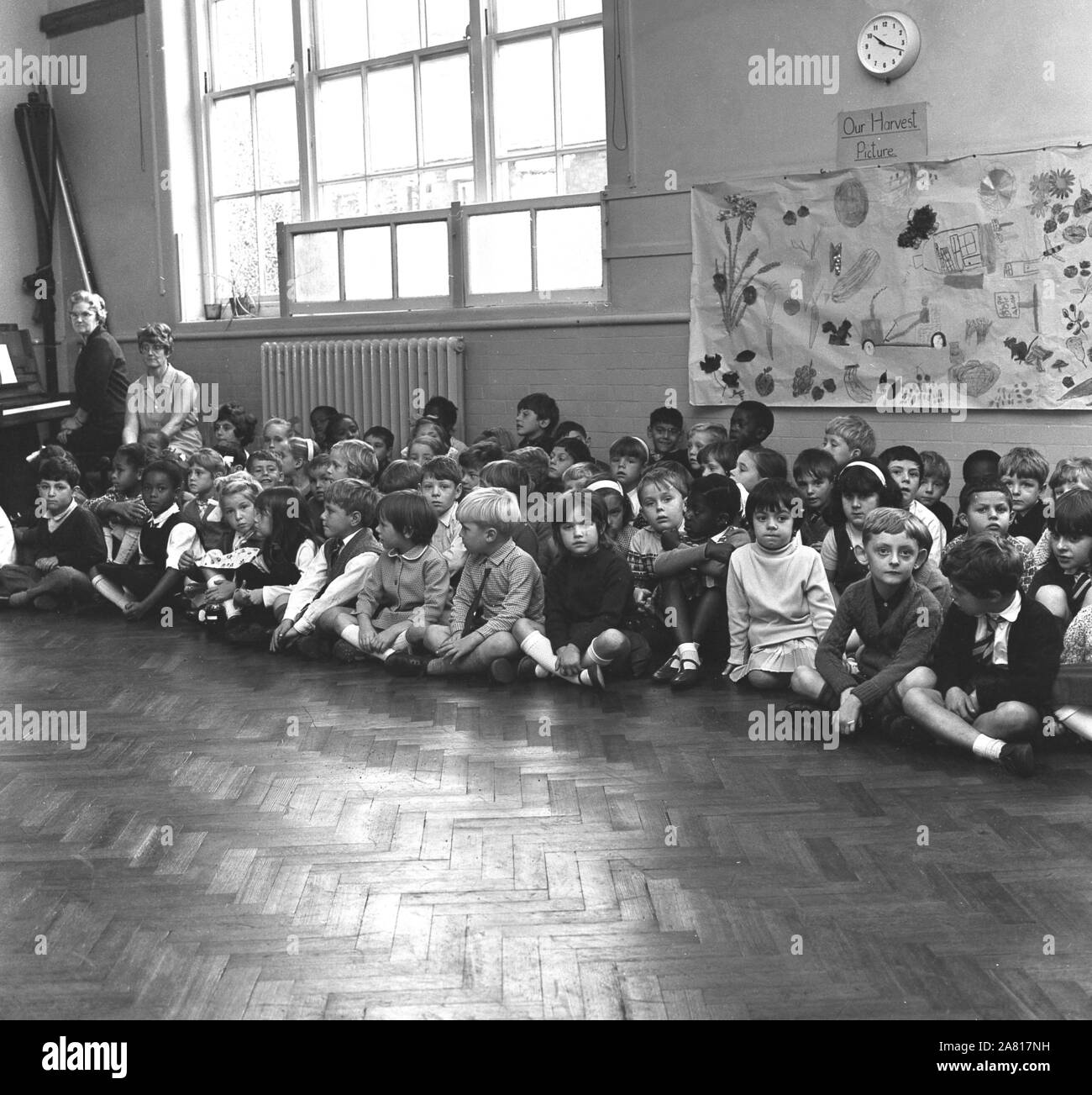 1960s, historical, primary school children sitting on the floor of a ...