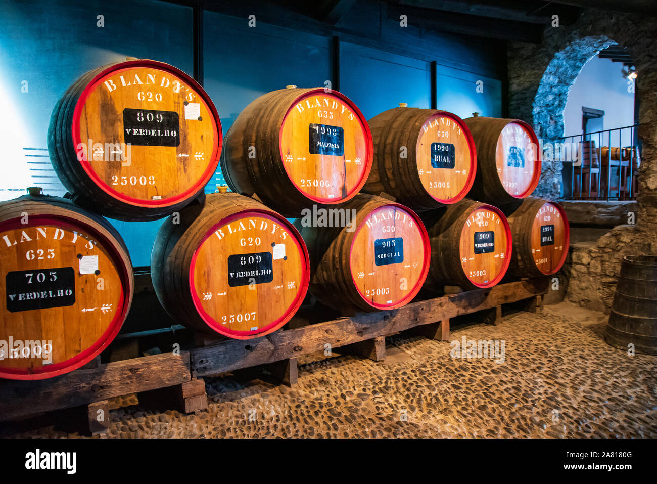 Wine barrels stored inside the Madeira wine caves, showcasing the ...