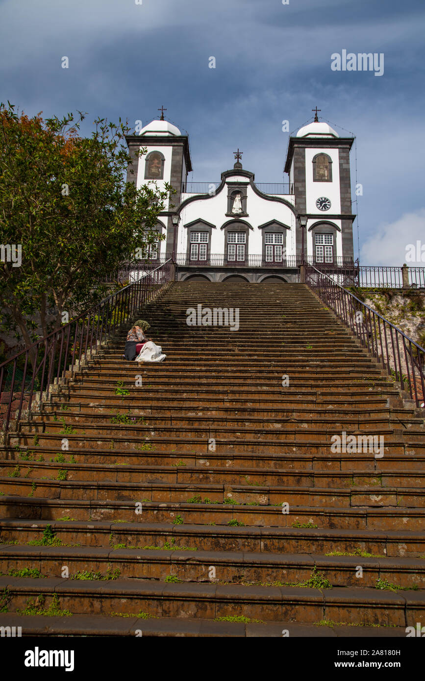 Visitors climbing the steps leading to the Church of Our Lady of Monte ...