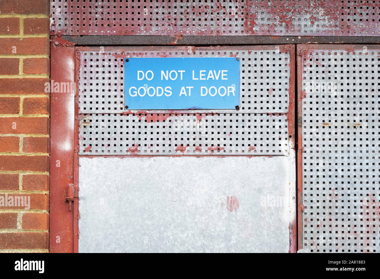 Do not leave goods at door sign at distribution of goods warehouse ...