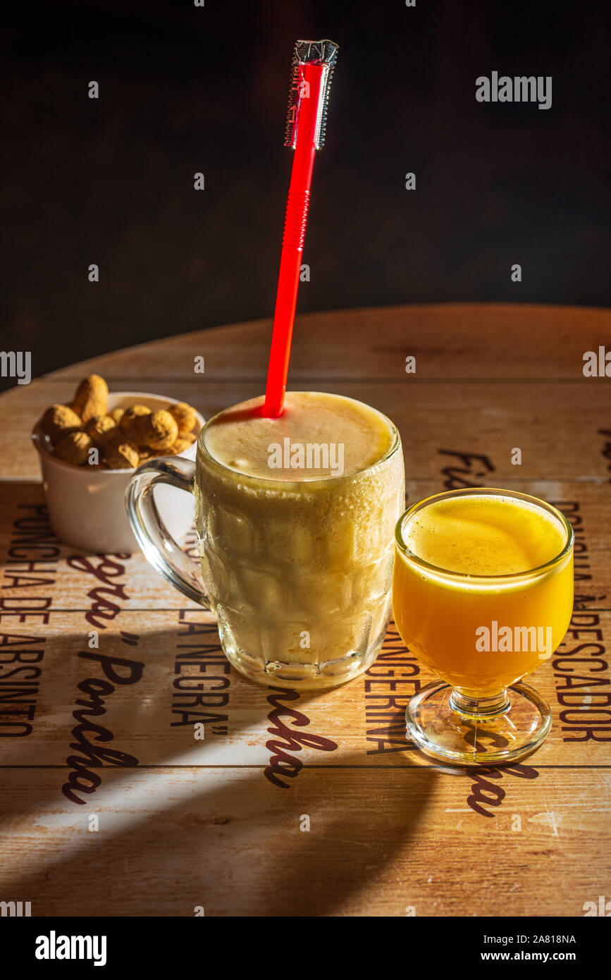 Two glasses of Poncha, the traditional Madeira cocktail, served with a ...