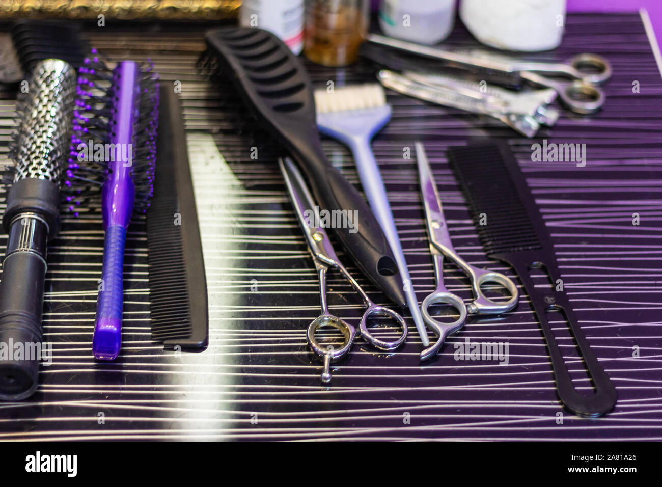 hairdresser tools. comb scissors and brushes laid out on the workspace ...