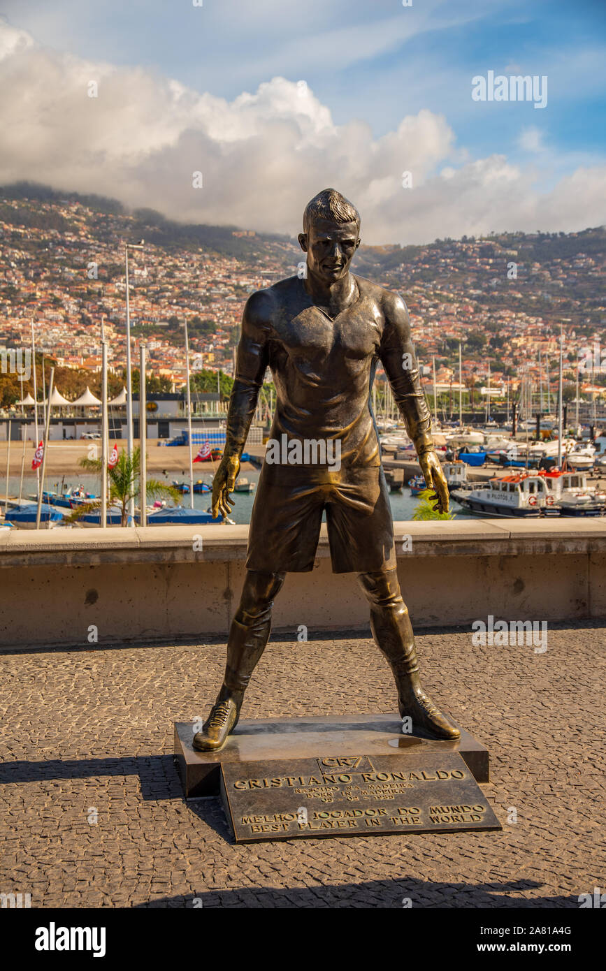 Bronze statue of a famous footballer near the marina in Funchal ...
