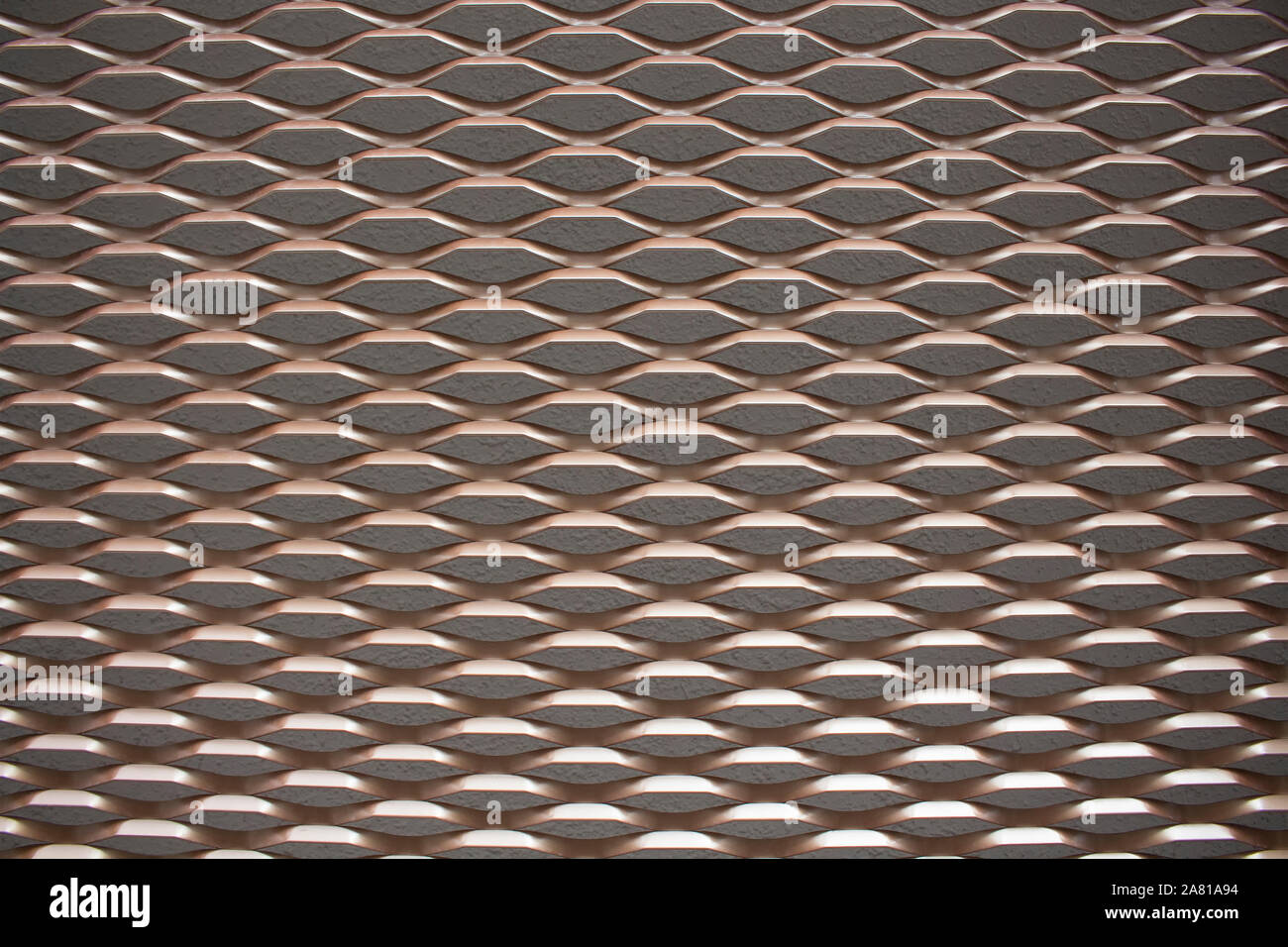 Close up view of bronze colored metal mesh background Stock Photo - Alamy
