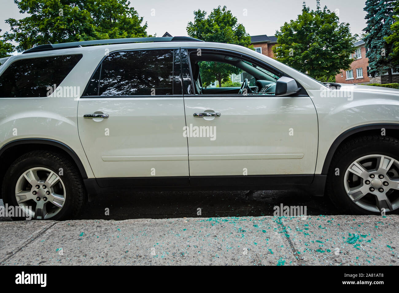 Montreal, Quebec, Canada - A vandalized car with the front passenger ...