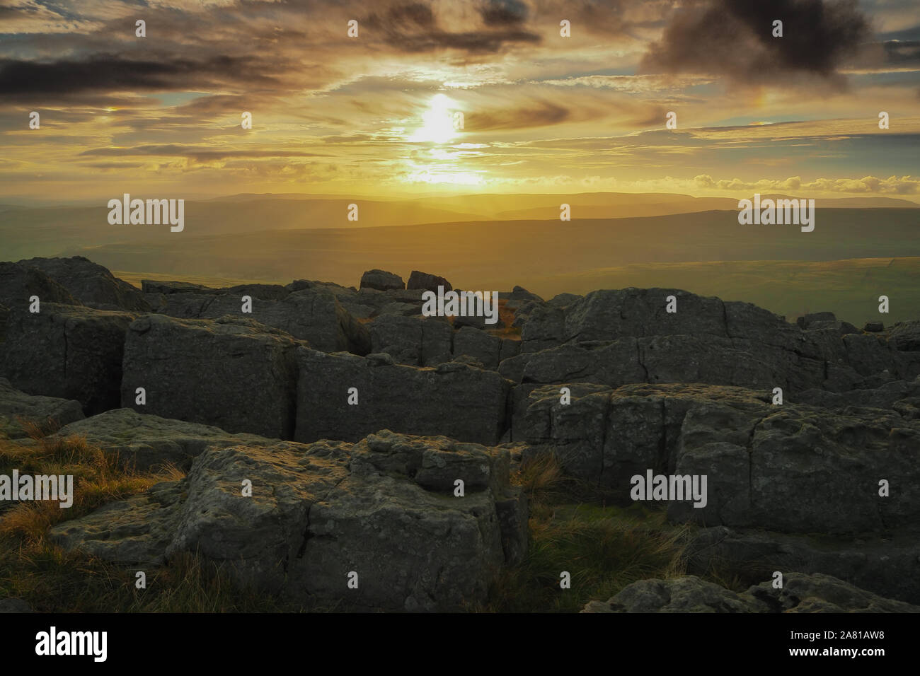 Stunning sunset from the rocky top of Great Whernside overlooking ...