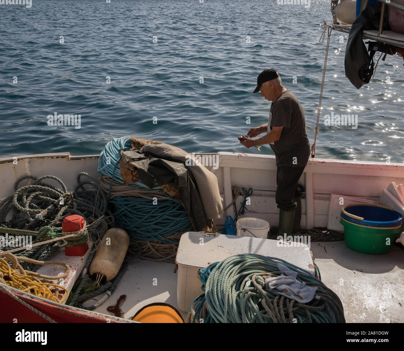 Cleaning a fishing boat hi-res stock photography and images - Alamy