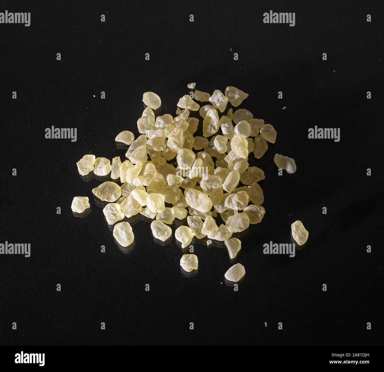 Mastic resin tears. Chios mastic on gray black background, top view ...