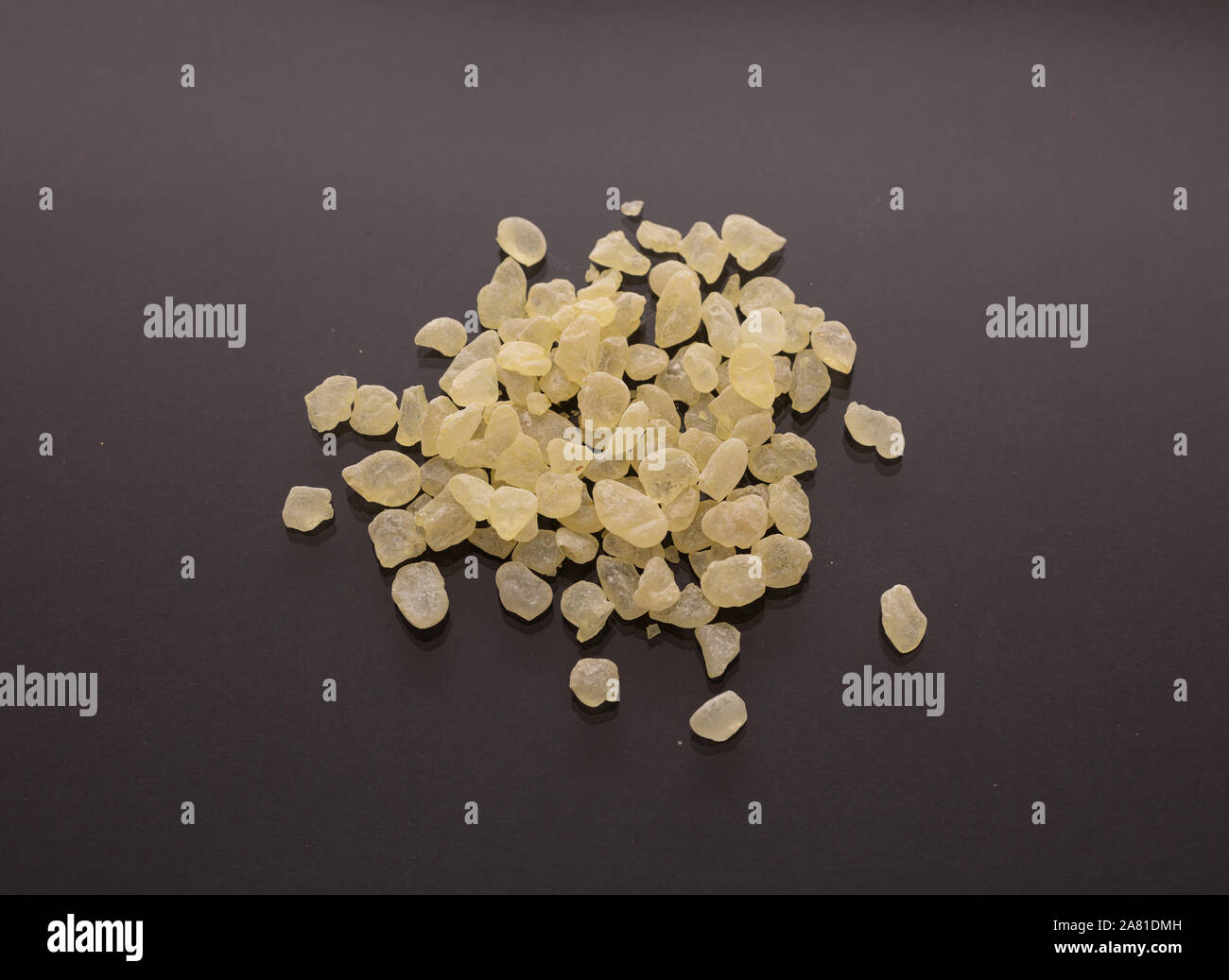 Mastic resin tears. Chios mastic on gray black background Stock Photo ...