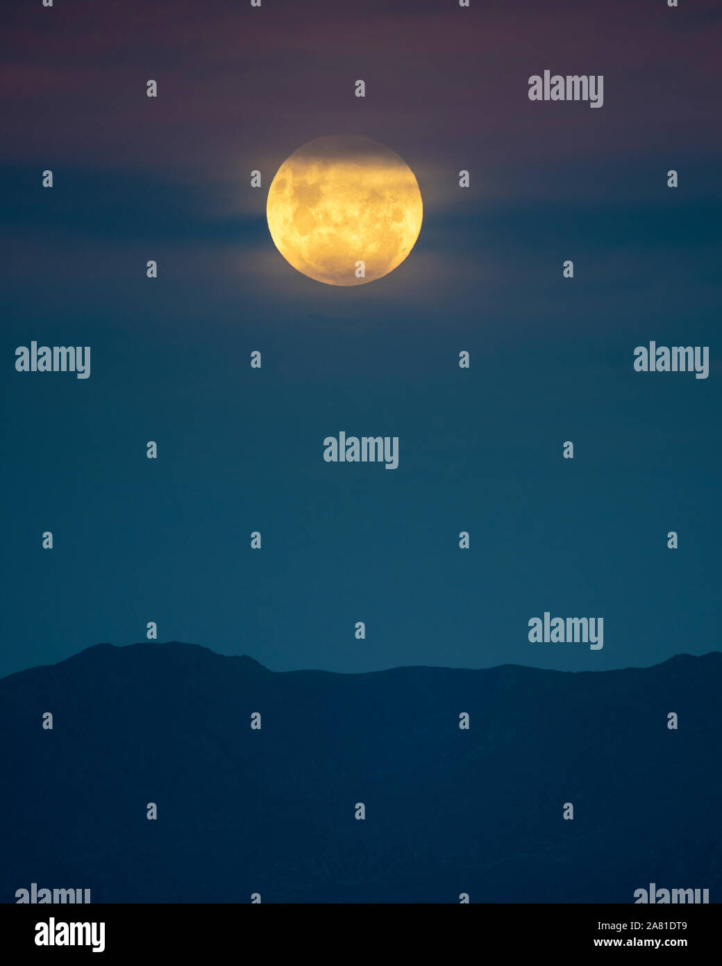 Bright moon rising from behind hi-res stock photography and images - Alamy