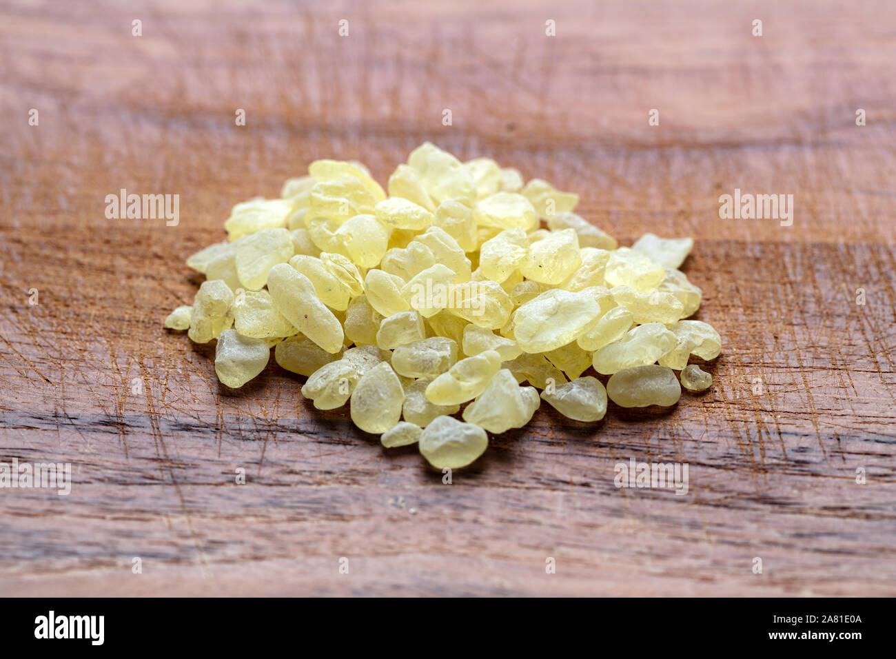 Mastic resin tears. Chios mastic isolated on wood background, closeup ...
