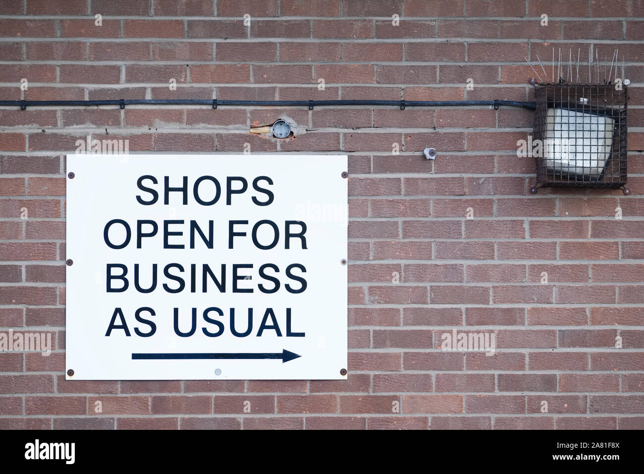 Shops open for business as usual sign Stock Photo - Alamy