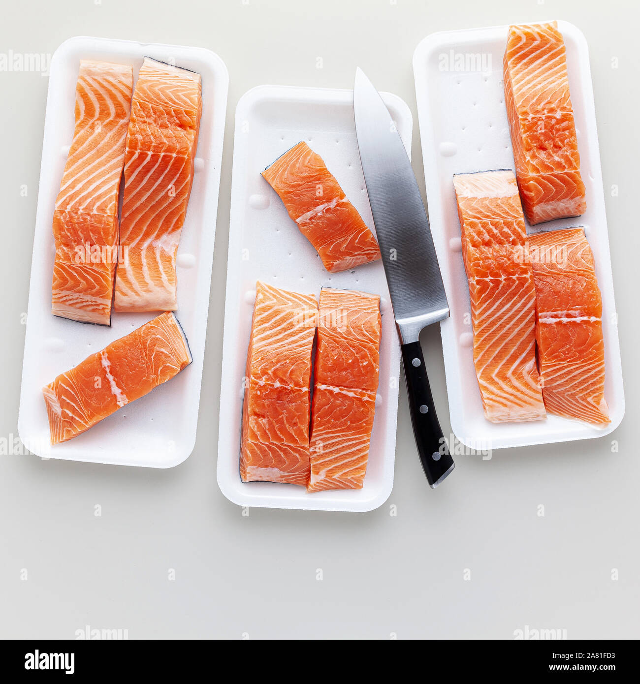 fresh salmon, cut into pieces and ready for cooking. fish cutting, and ...