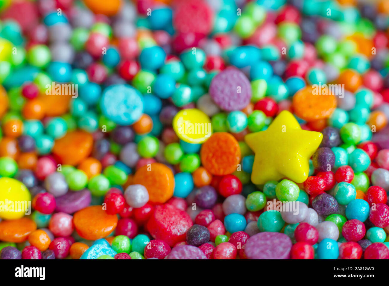 Extremely close-up colorful heart-shaped confectionery powder ...