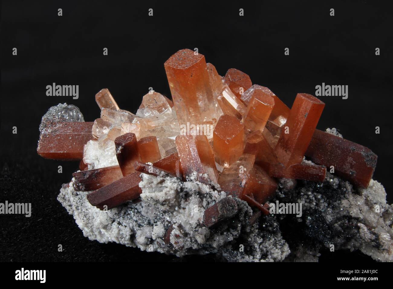 Rock matrix with small crystals and orange and clear topaz Stock Photo ...