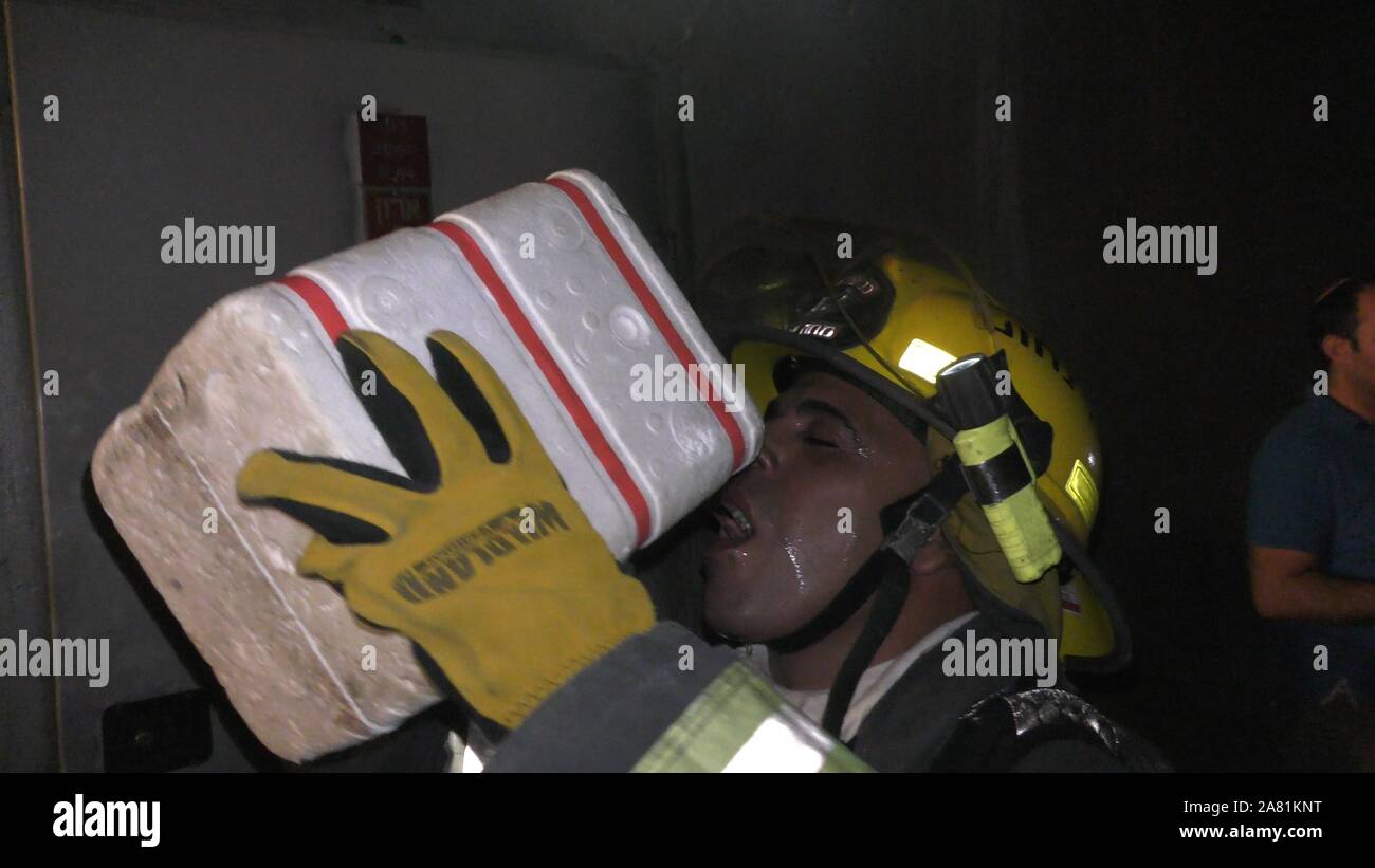 Fireman relaxing at a fire hi-res stock photography and images - Alamy