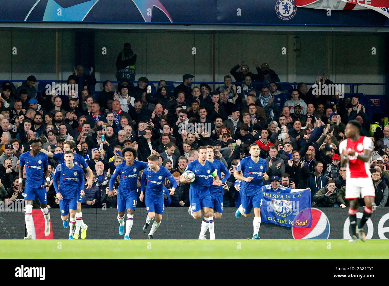 Chelsea fans cheer on their team hi-res stock photography and images ...