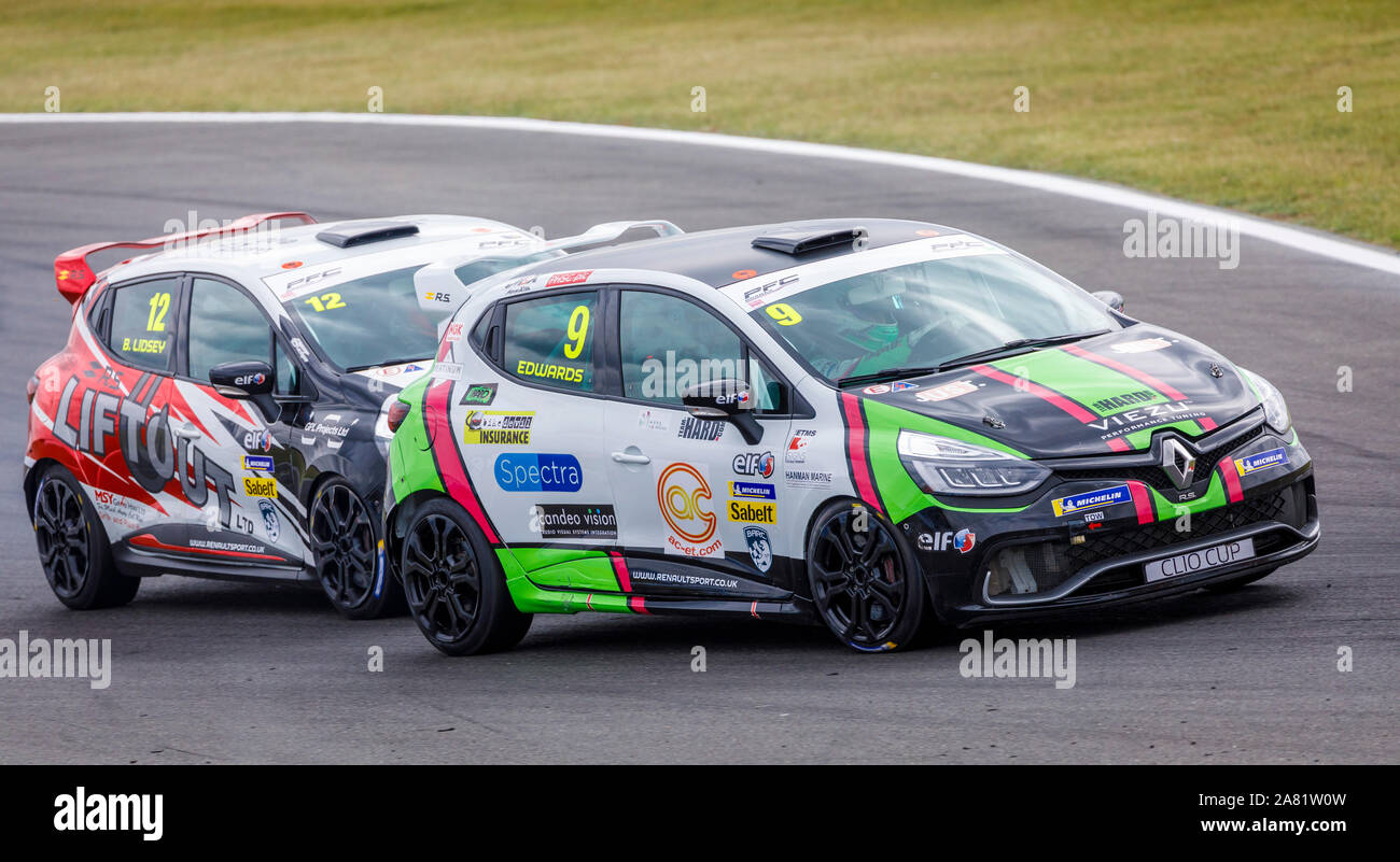 Jade Edwards and Brett Lidsey battle it out during the Renault Clio Cup race at the 2019 BTCC ...