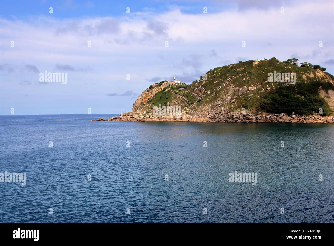 The lighthouse of Getaria from Zarautz beach and landscape of basque ...