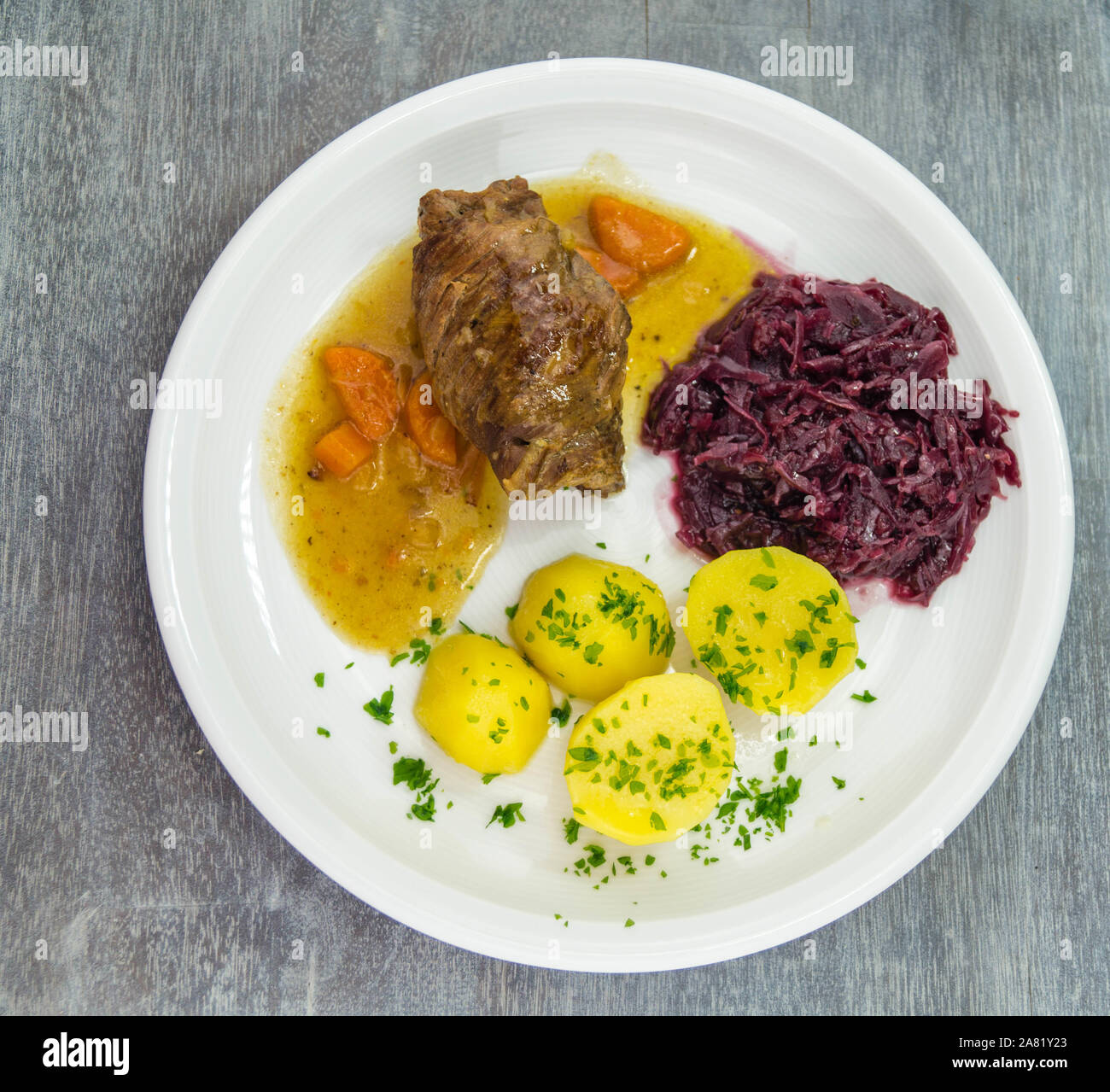 traditional german Food Beef Roulade with red cabbage Stock Photo - Alamy