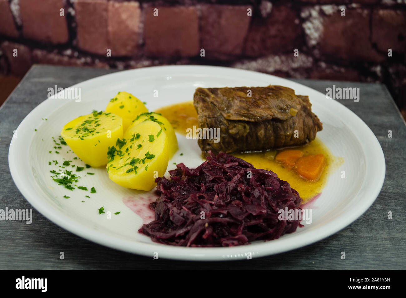traditional german Food Beef Roulade with red cabbage Stock Photo - Alamy