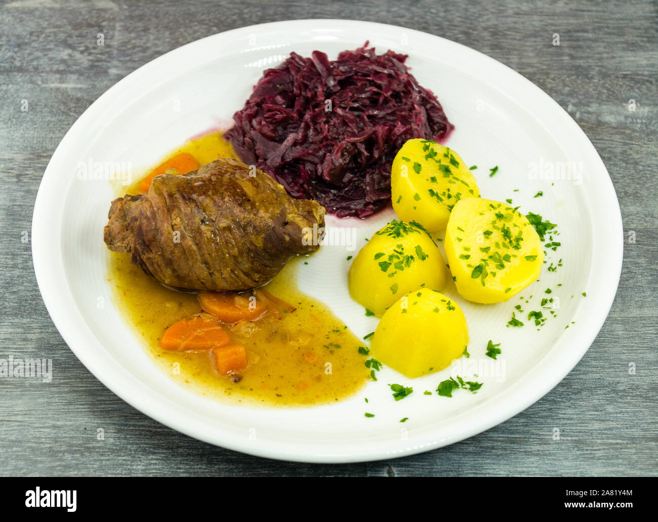 traditional german Food Beef Roulade with red cabbage Stock Photo - Alamy