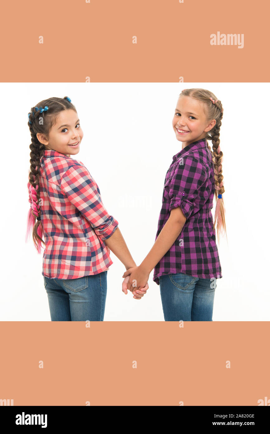 Happiness is friendship. Happy children hold hands isolated on white ...