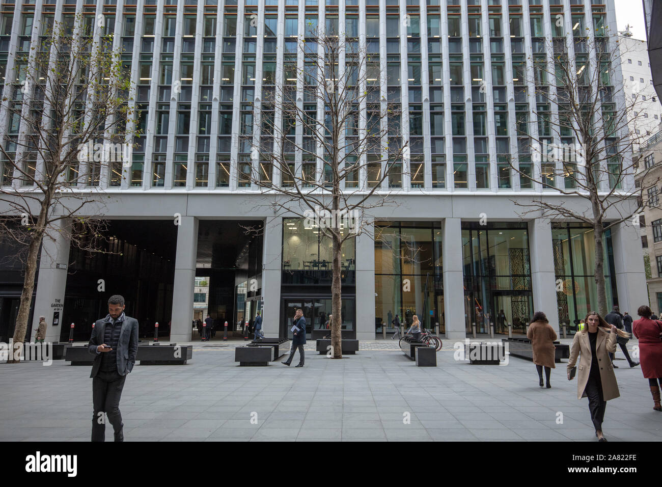 Three trees seen in an open space between high rise office buildings in ...
