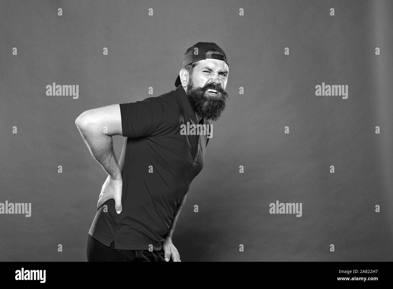 My back hurts. Man painful face touches lower back. Problems with ...