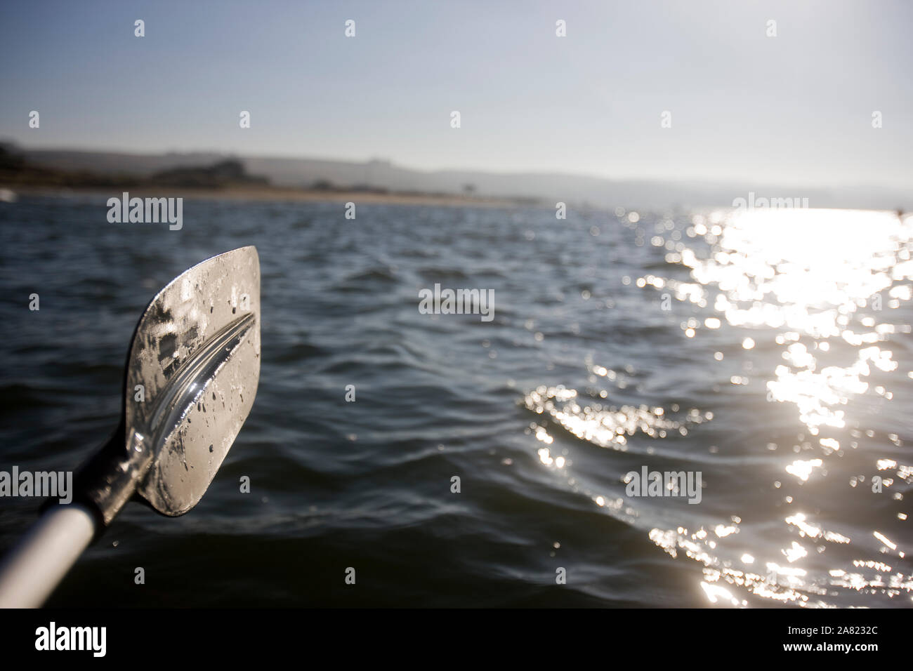 Oar rising above the ocean Stock Photo - Alamy