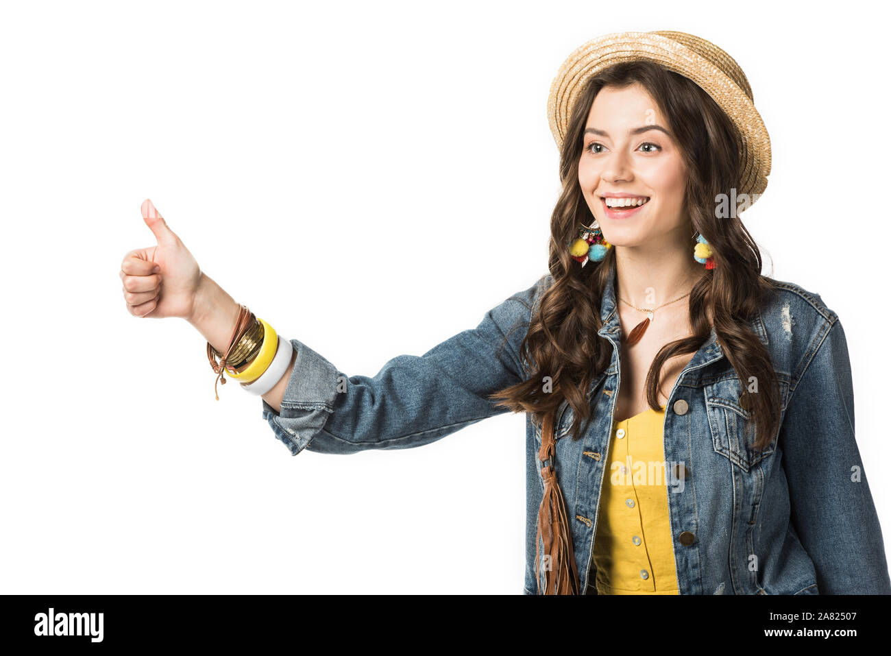 laughing boho girl in straw hat showing thumb up isolated on white ...