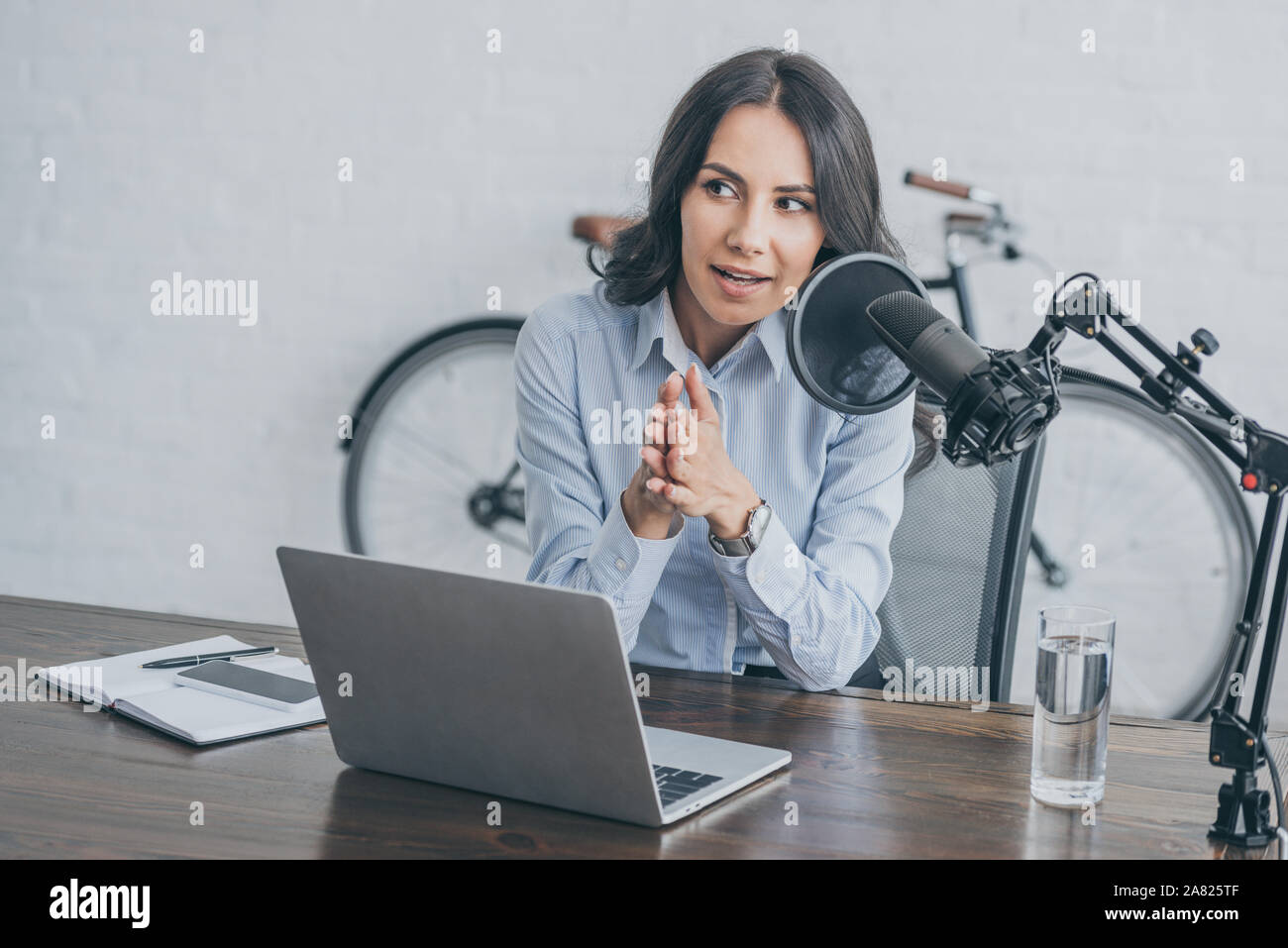 Woman Speaking Into Microphone High Resolution Stock Photography and ...