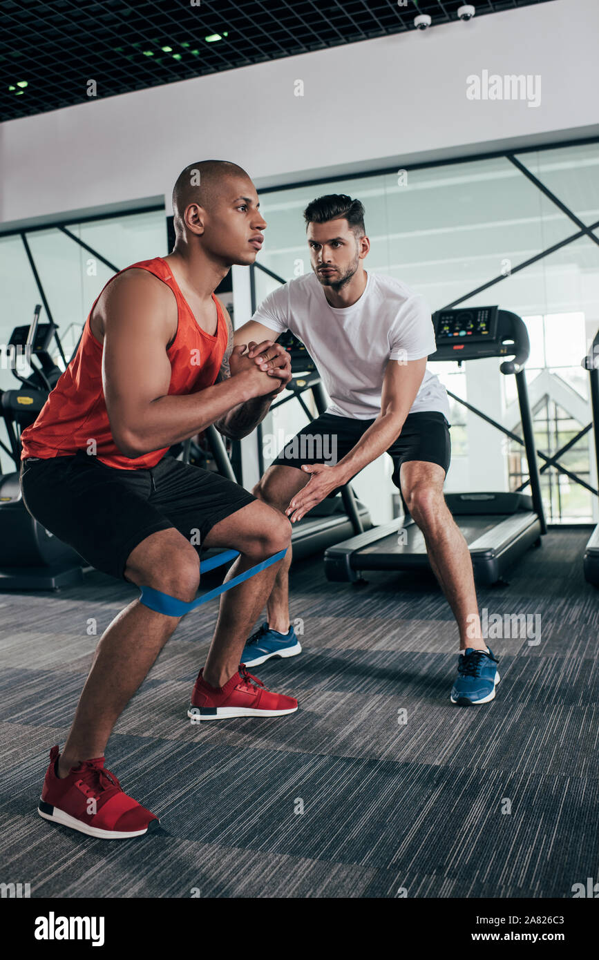 Concentrated african sportsman stretching hi-res stock photography and ...