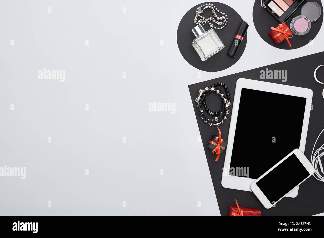 top view of gadgets, gift boxes, perfume, bracelets, decorative ...