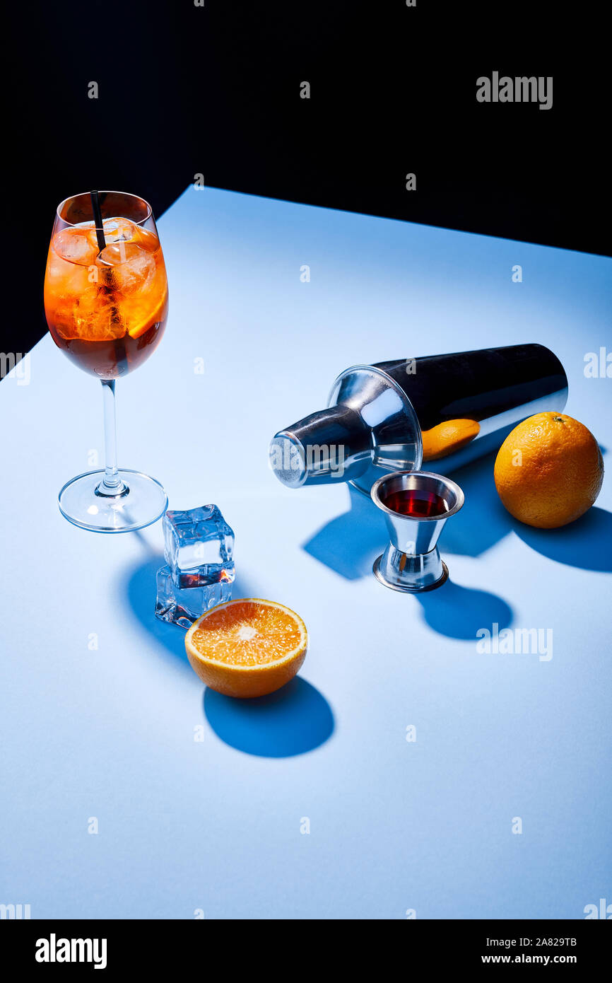 Aperol Spritz, oranges, shaker, ice cubes and measuring cup Stock Photo ...