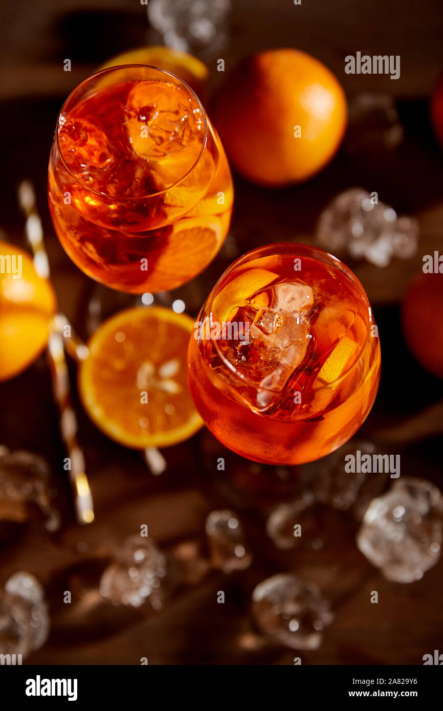 top view of Aperol Spritz in glasses, oranges and ice cubes Stock Photo ...