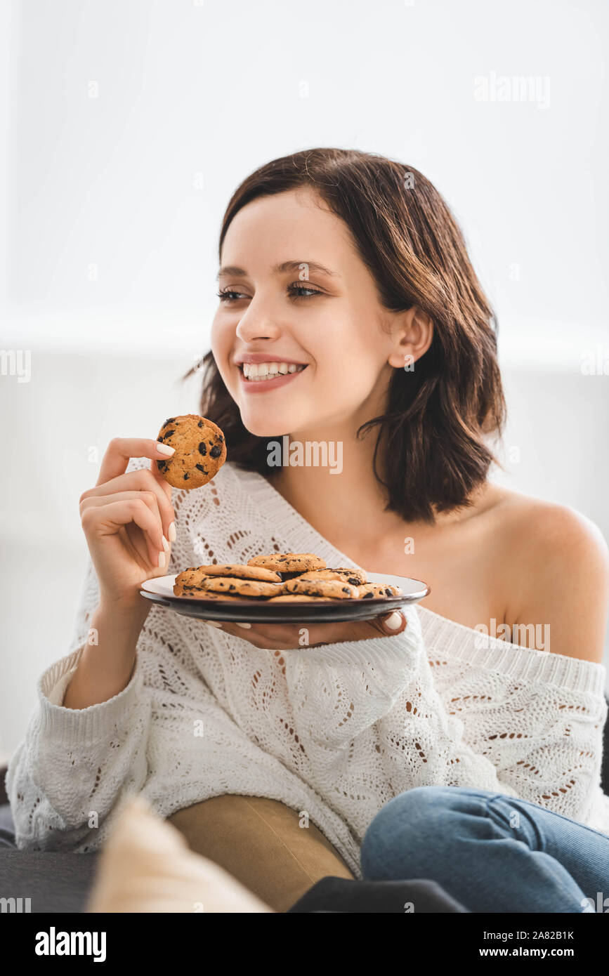 Pretty woman eating cookies hi-res stock photography and images - Alamy