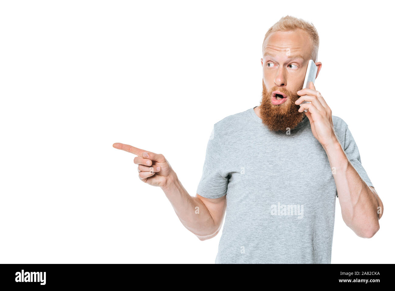 Young redhead man pointing Cut Out Stock Images & Pictures - Alamy