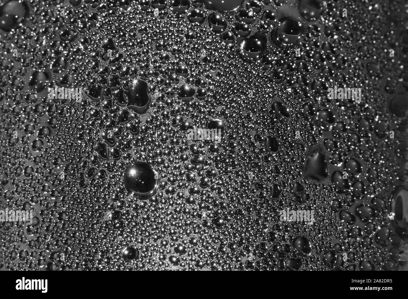 Natural dark silvery black water dew drops texture macro background ...