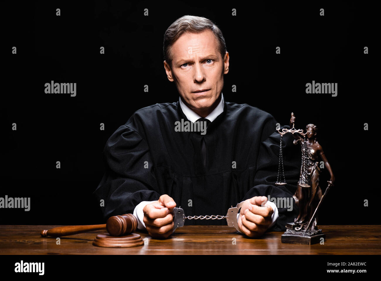 Wooden gavel handcuffs figure hi-res stock photography and images - Alamy