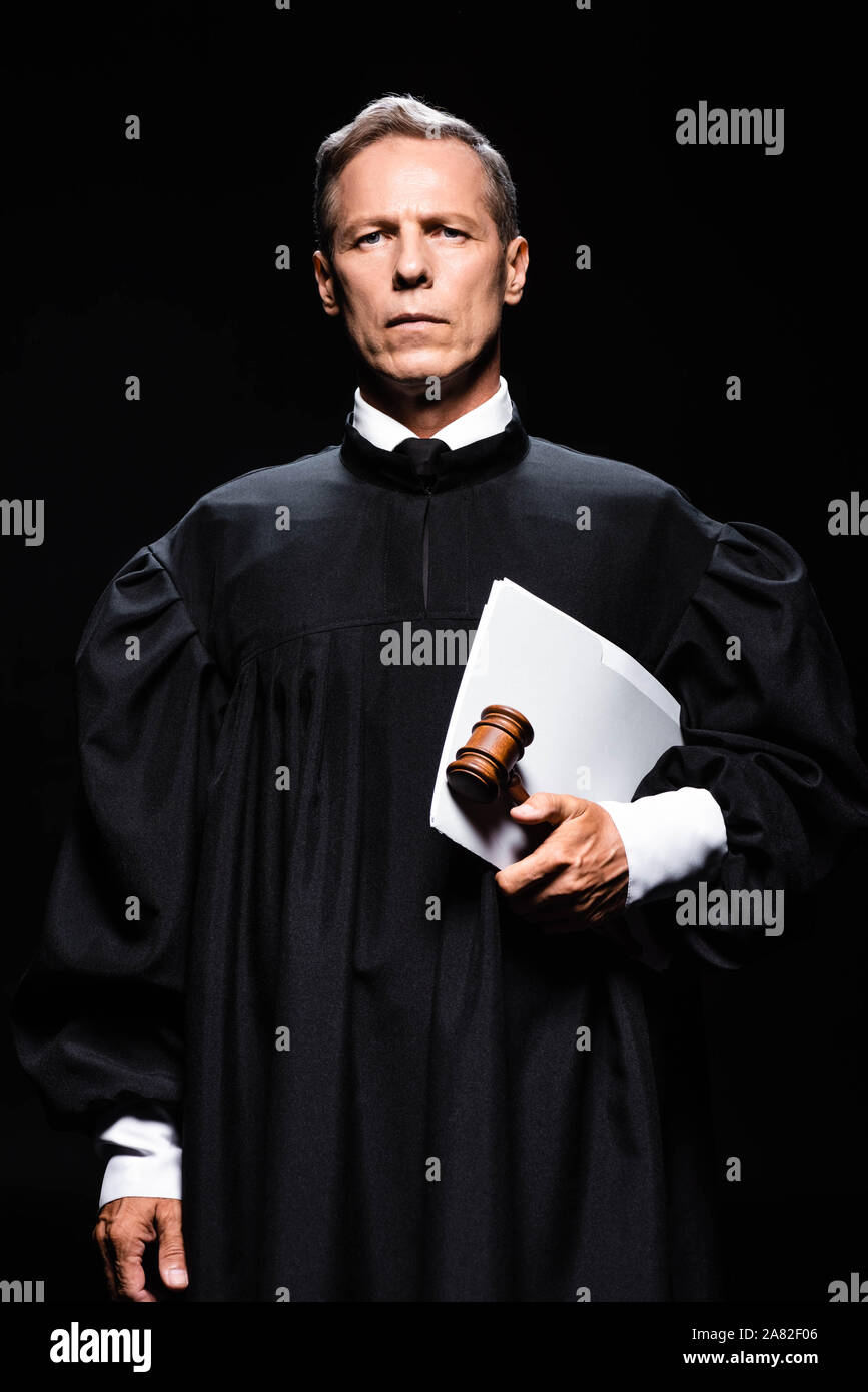 Middle-aged judge holding gavel Stock Photo - Alamy